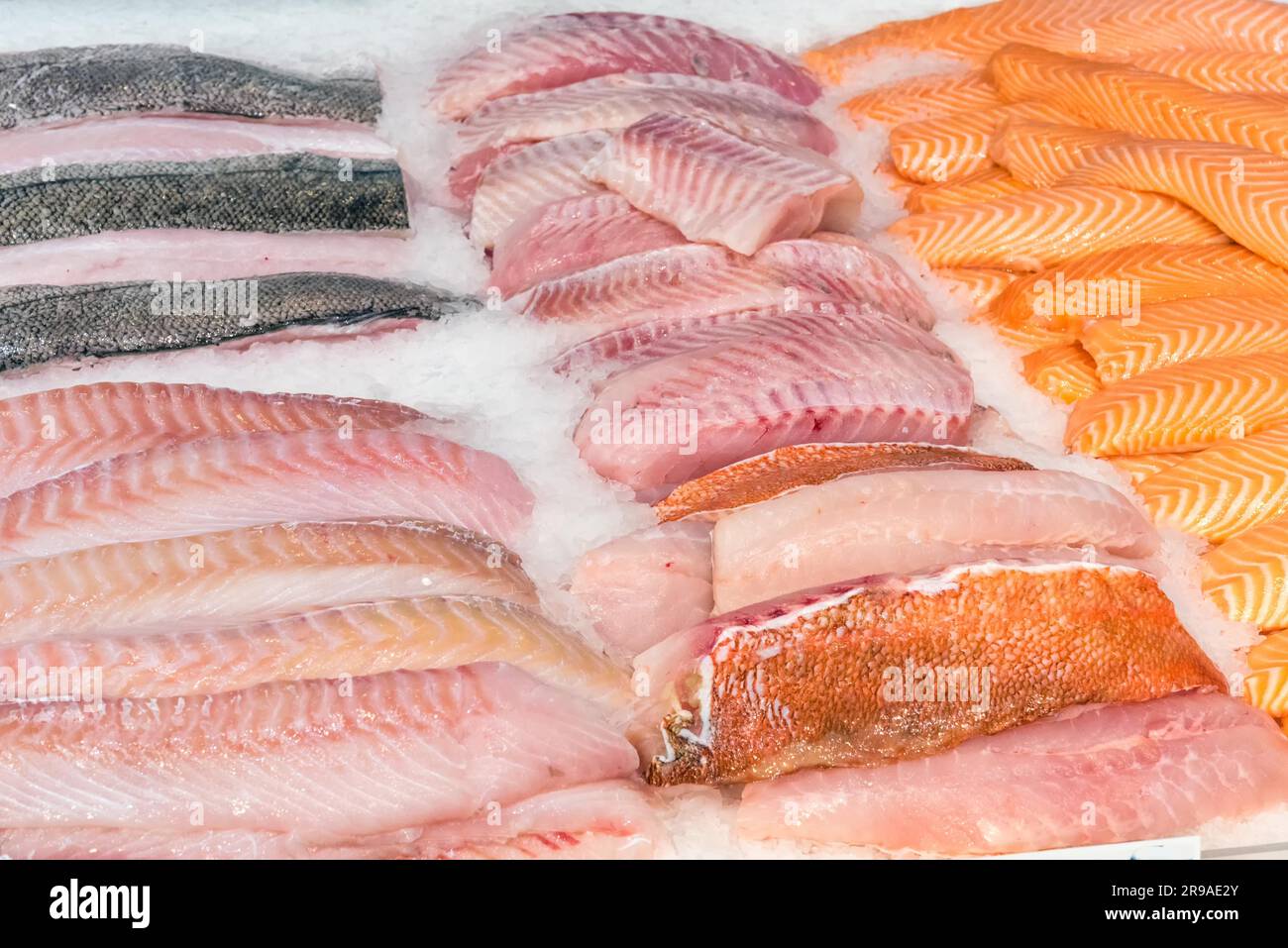 Fresh fish fillets for sale at the fish market Stock Photo - Alamy