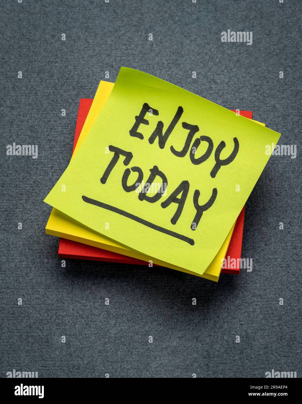 Enjoy today reminder - handwriting on a sticky note, positive attitude ...