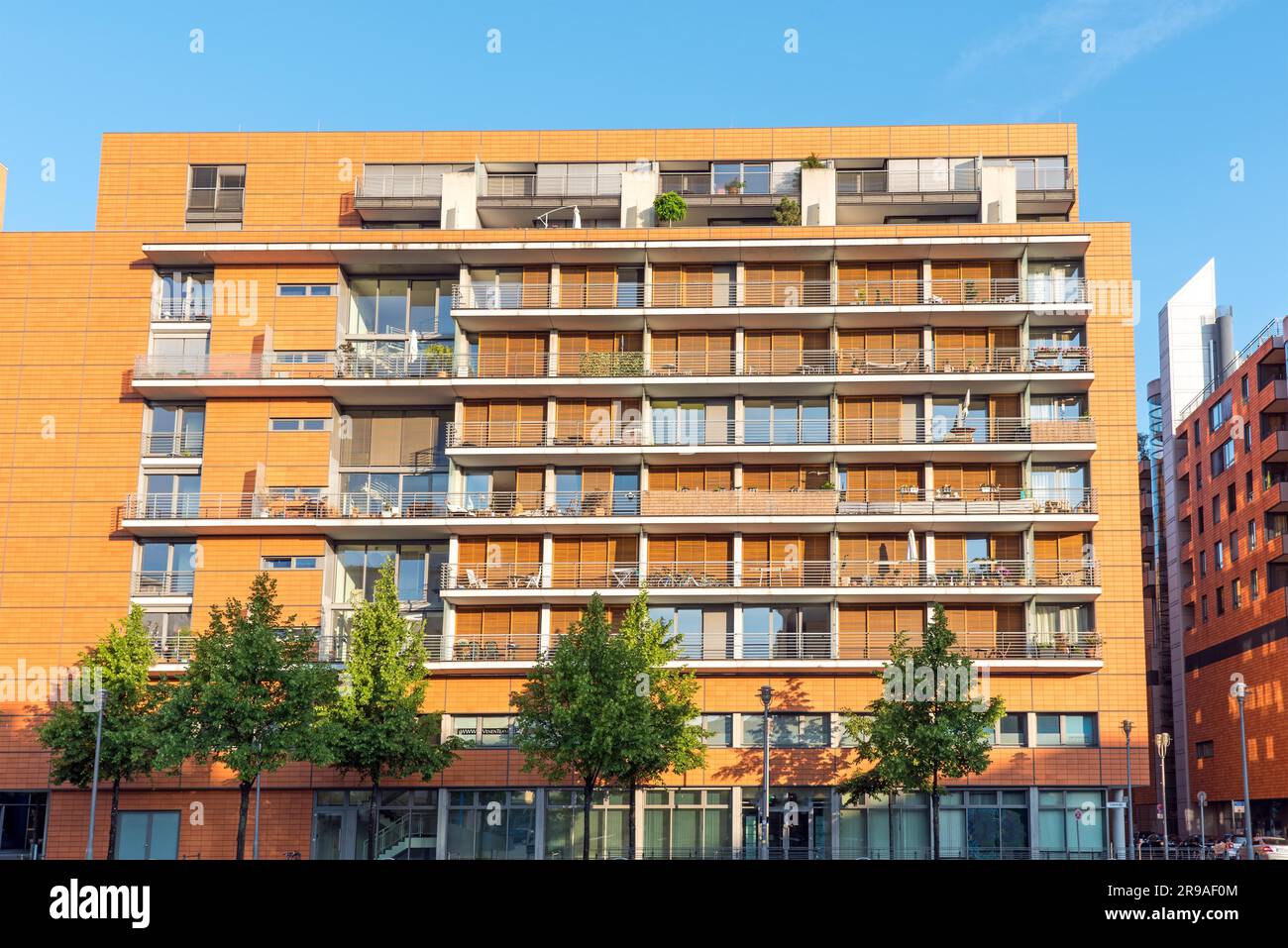 Modern orange apartment building in Berlin, Germany Stock Photo - Alamy