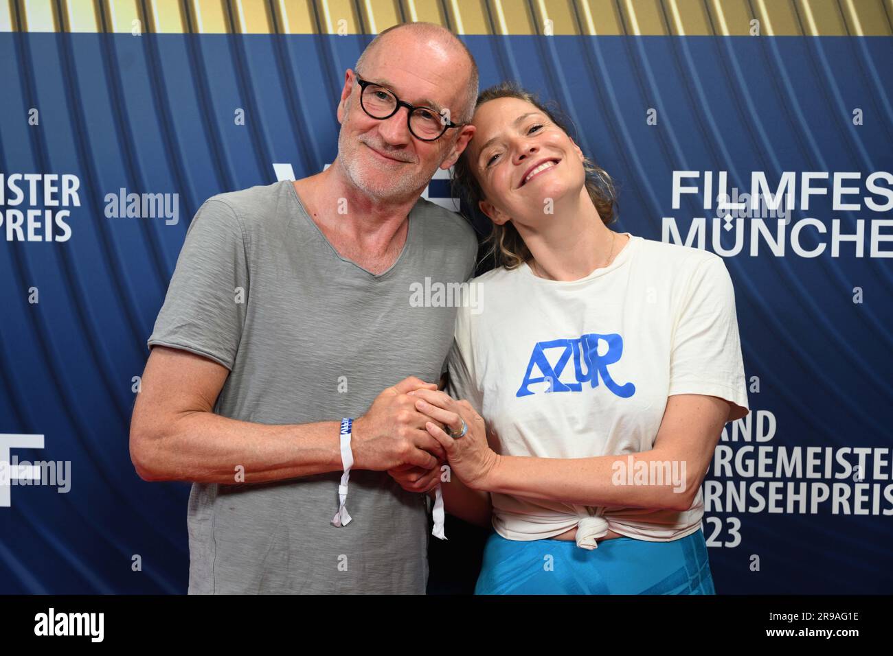Munich, Germany. 25th June, 2023. Actor Peter Lohmeyer and actress Patricia Aulitzky stand on ...