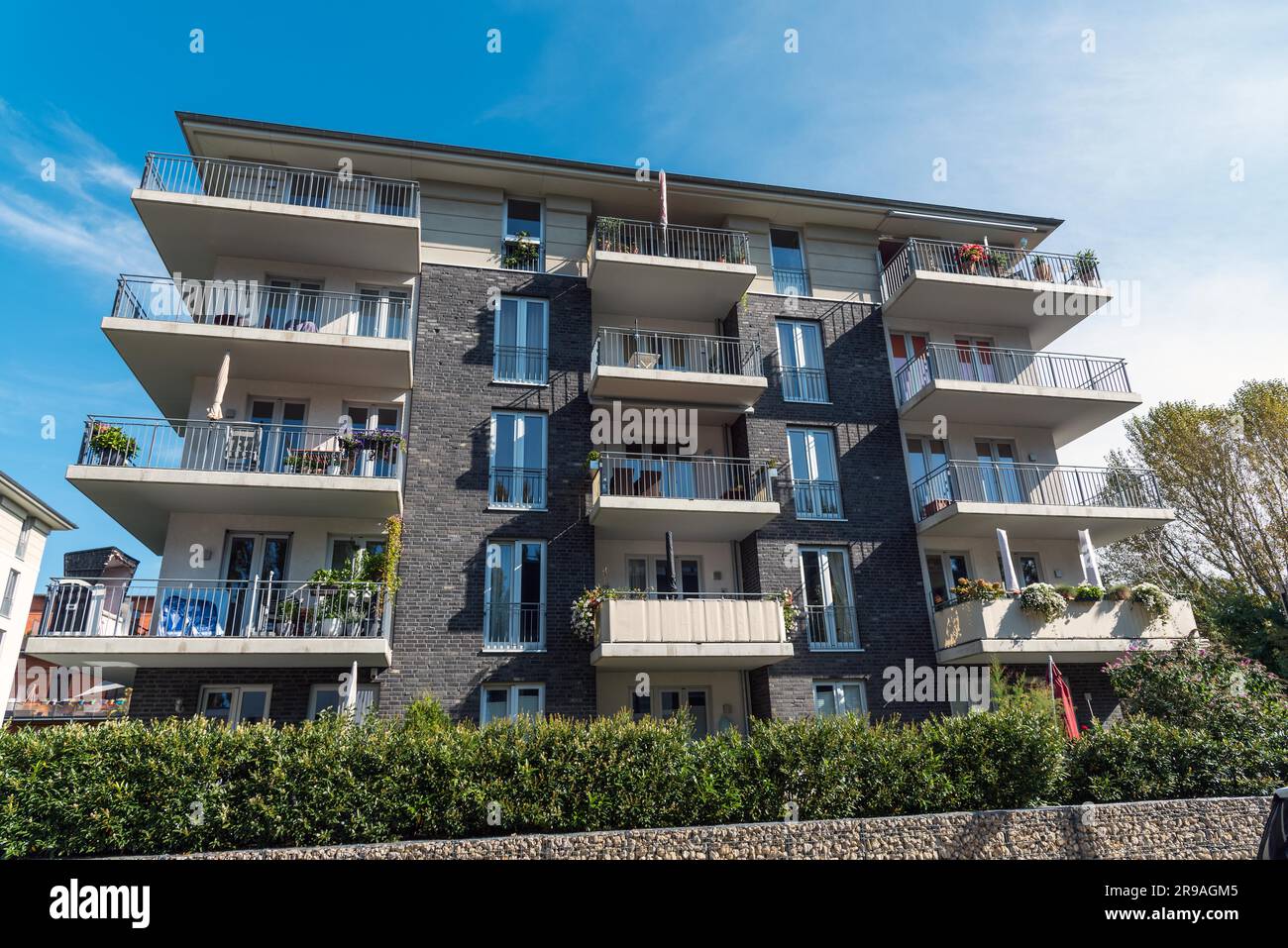 New grey apartment building seen in Berlin, Germany Stock Photo - Alamy