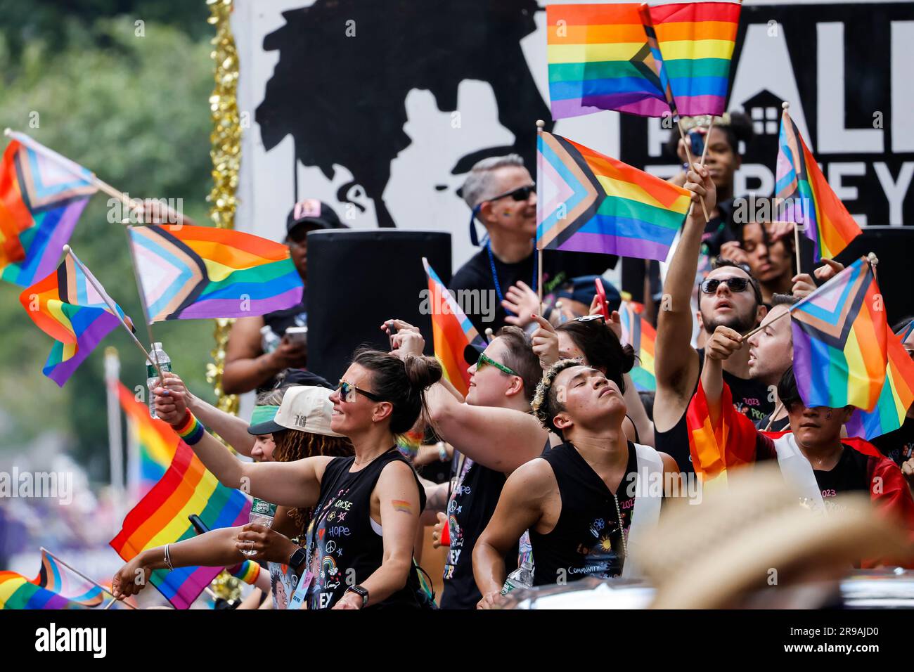 New York, United States. 25th June, 2023. Participants wave rainbow ...