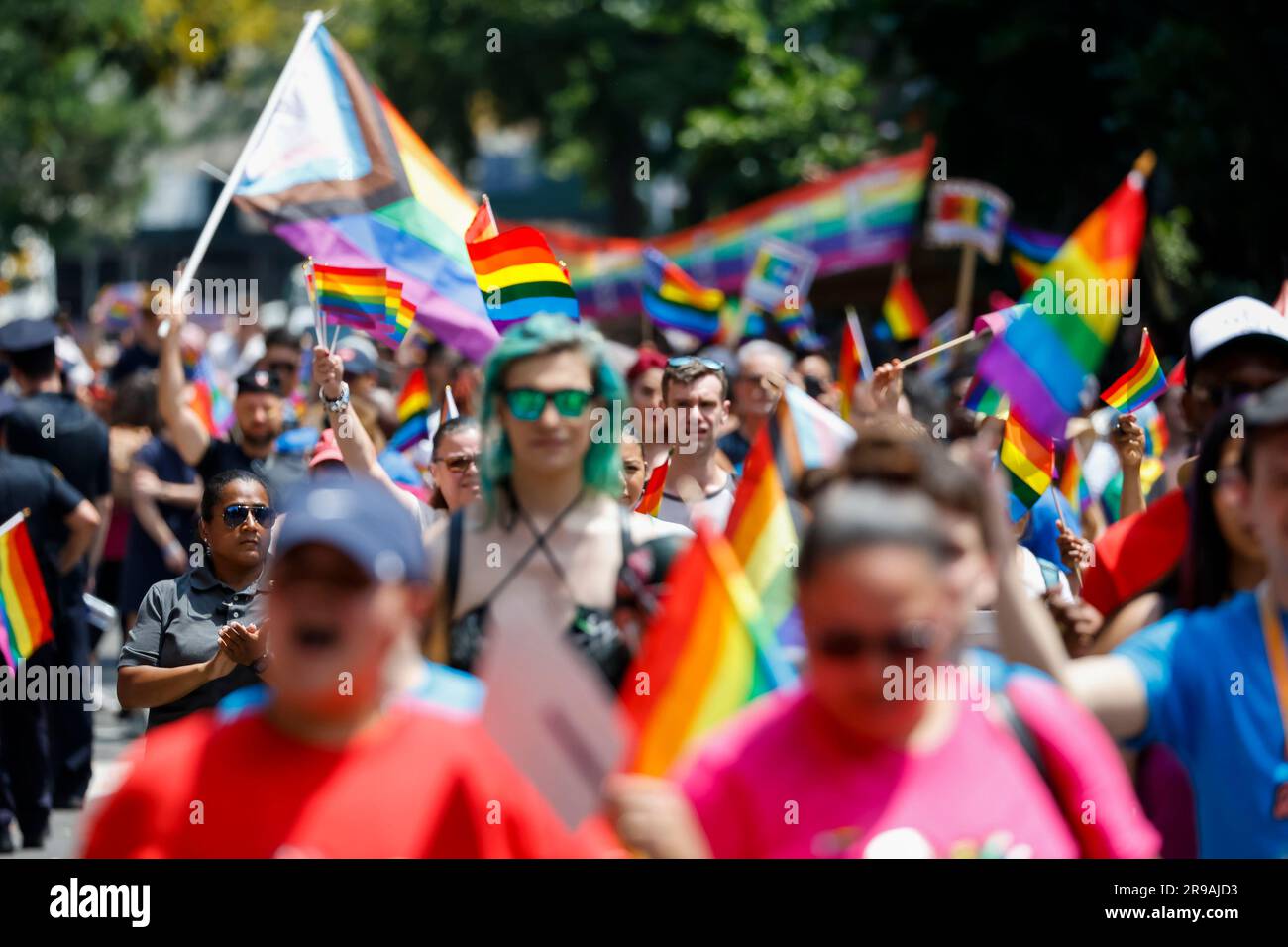 New York, United States. 25th June, 2023. Parade marchers wave rainbow ...