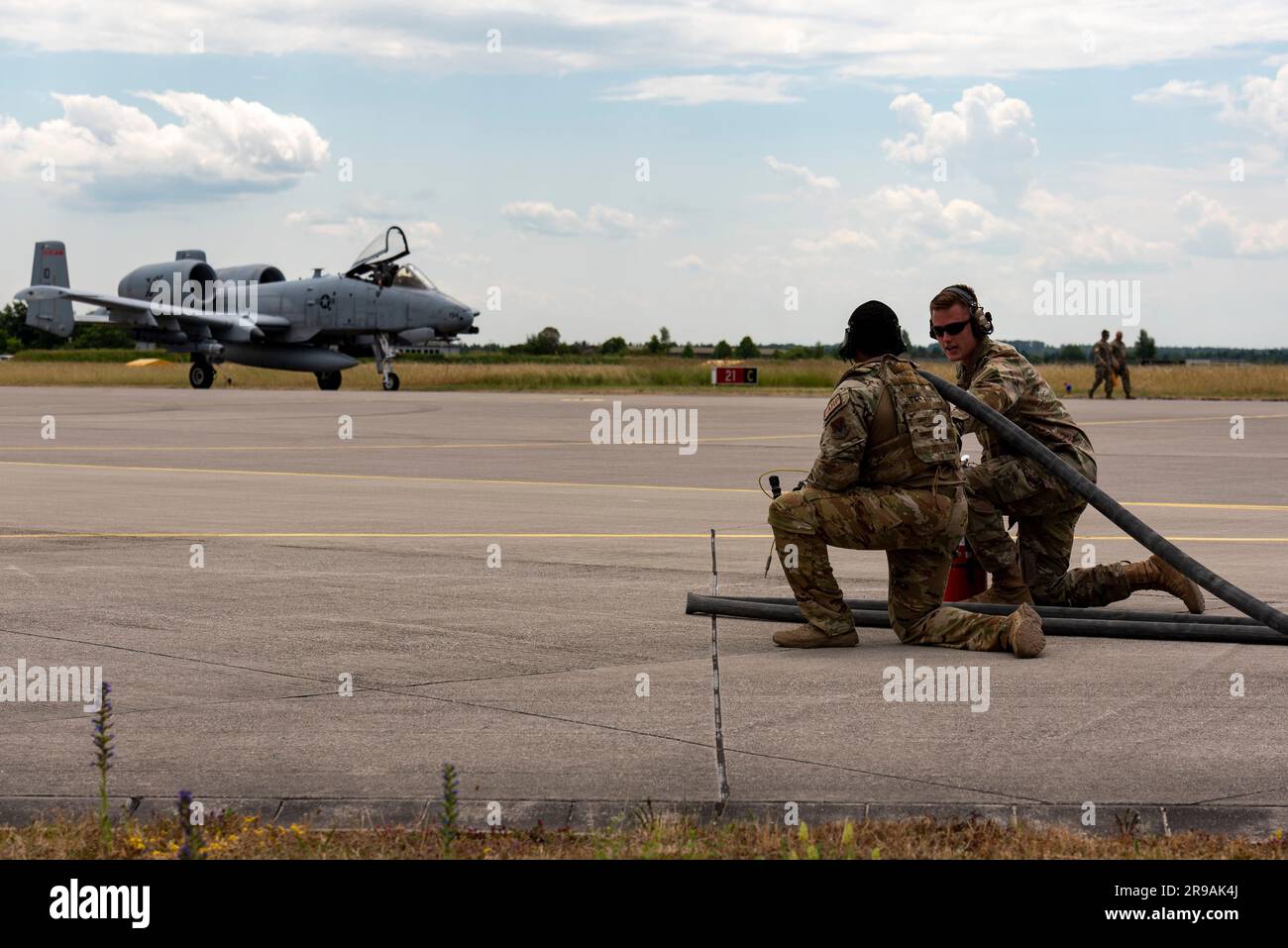U.S. Air Force Staff Sgt. Brandon Harris, left, a forward arming and ...