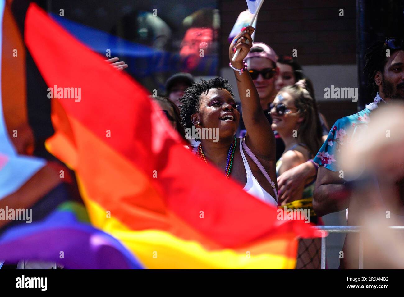 Lauren Kaboggoza waves a flag as she watches Chicago's 52nd annual ...