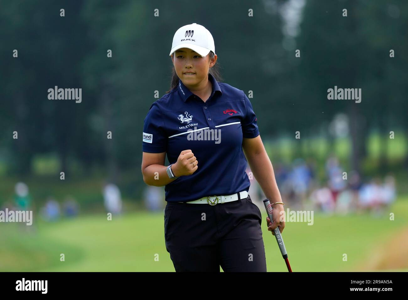 Ruoning Yin, of China, reacts after making a birdie putt on the 18th ...