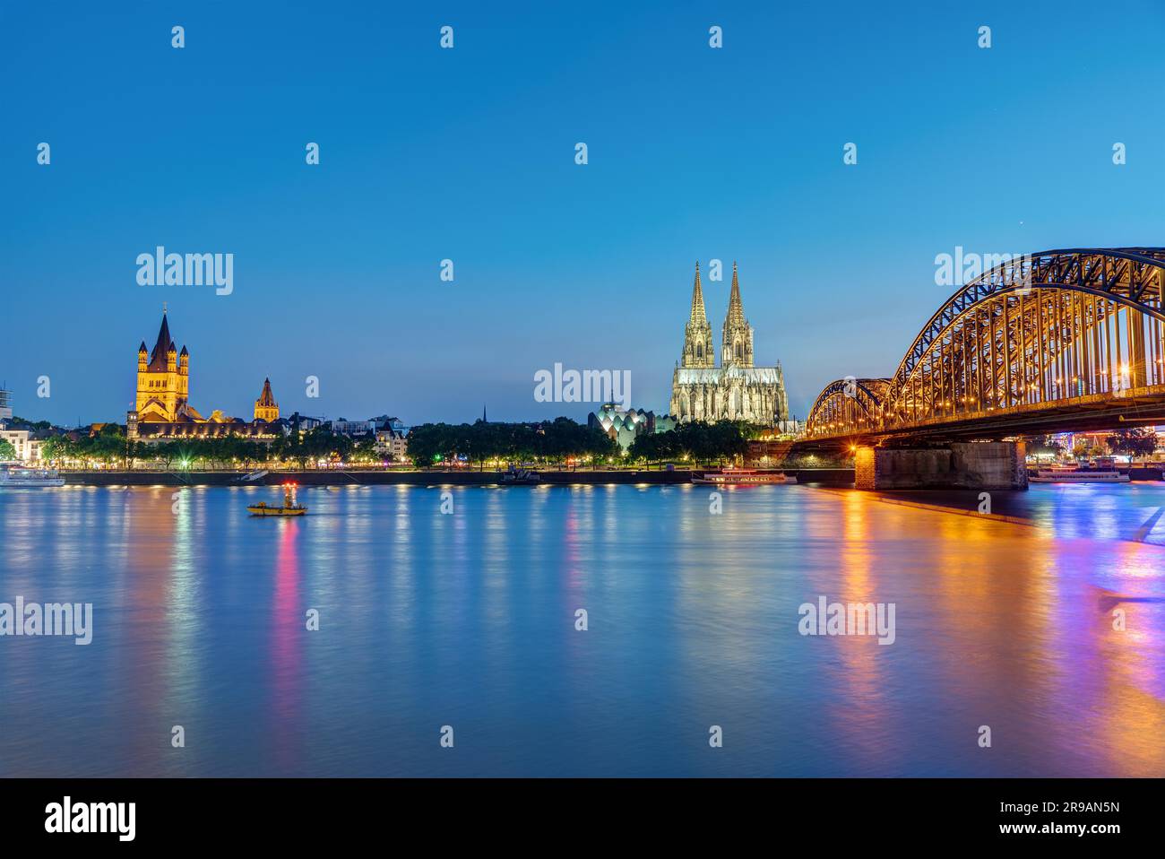 The Rhine with the famous skyline of Cologne after sunset Stock Photo ...