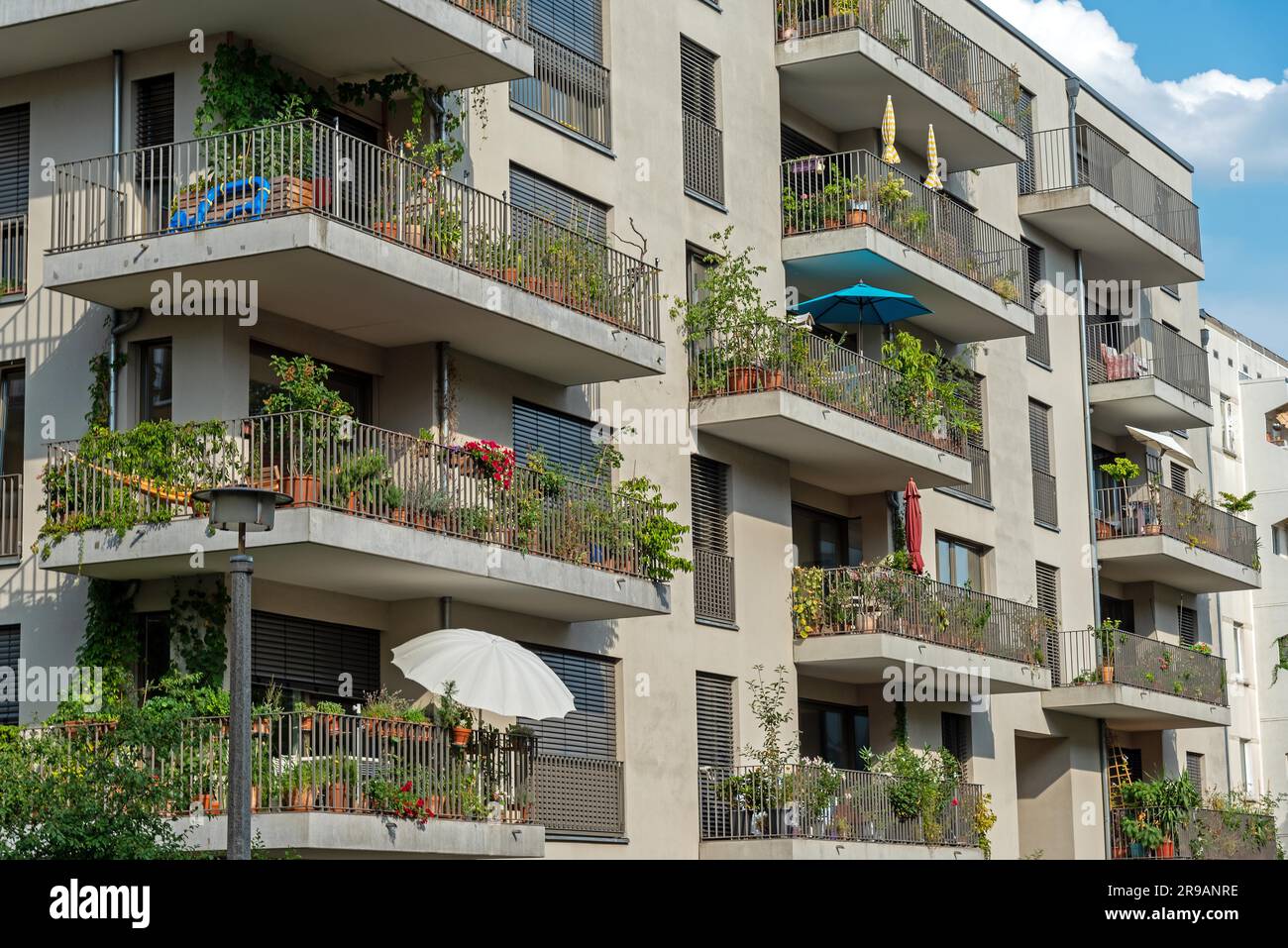 Modern grey apartment building with large balconies in Berlin Stock ...