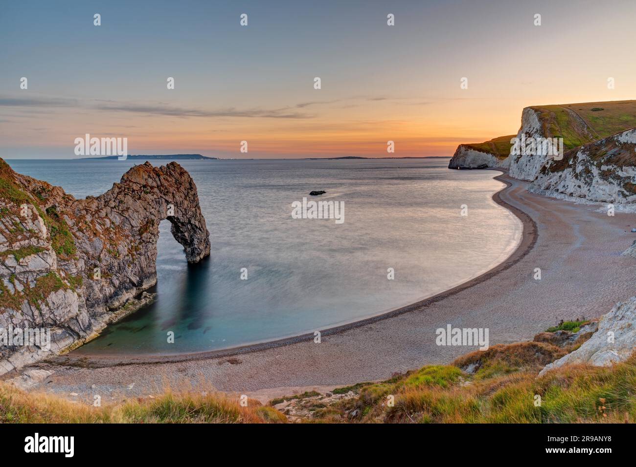 The natural rock bridge Durdle Door on the Jurassic Coast in England ...