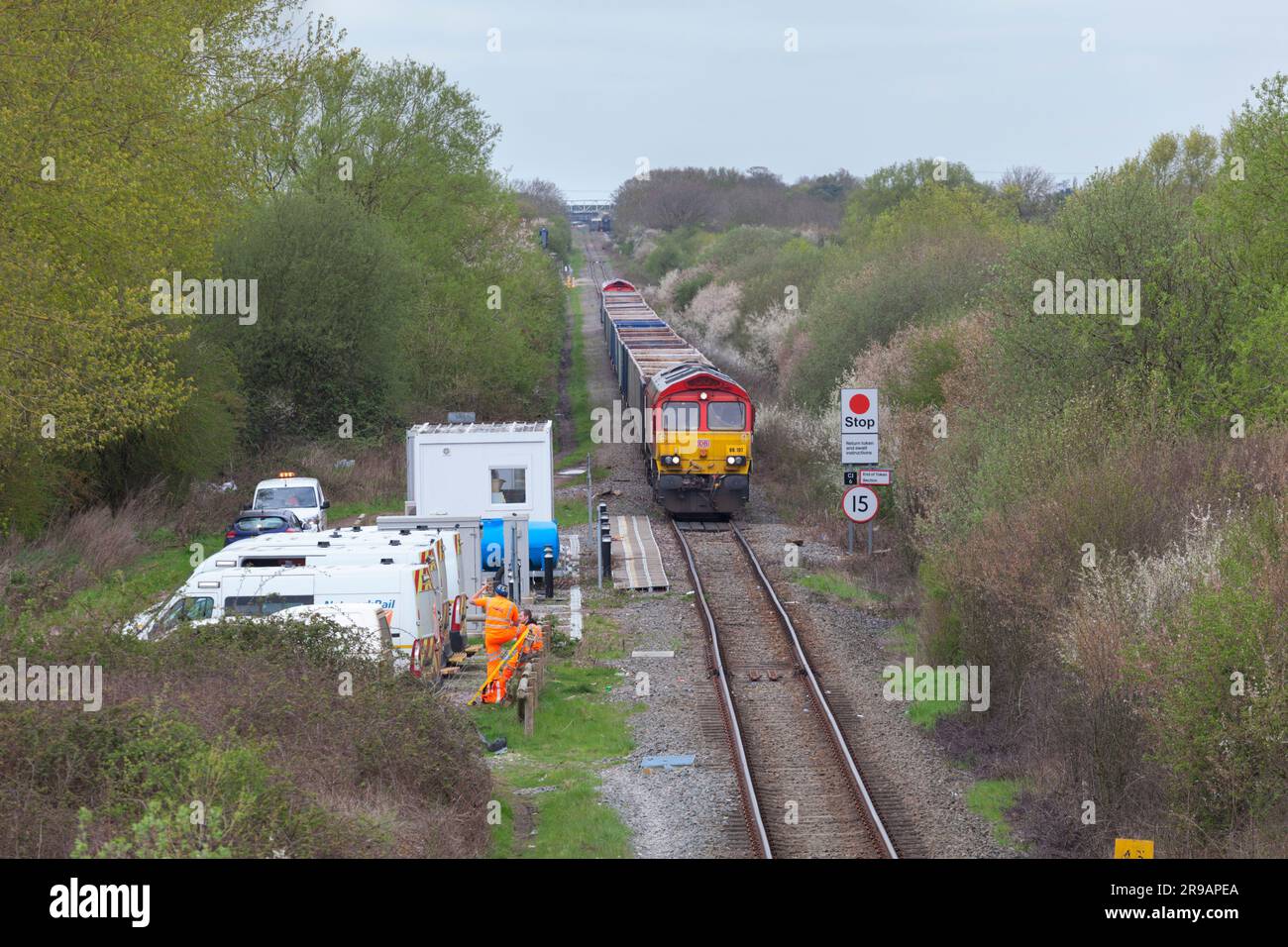 DB Cargo rail UK class 66 diesel locomotive hauling a train of empty ...