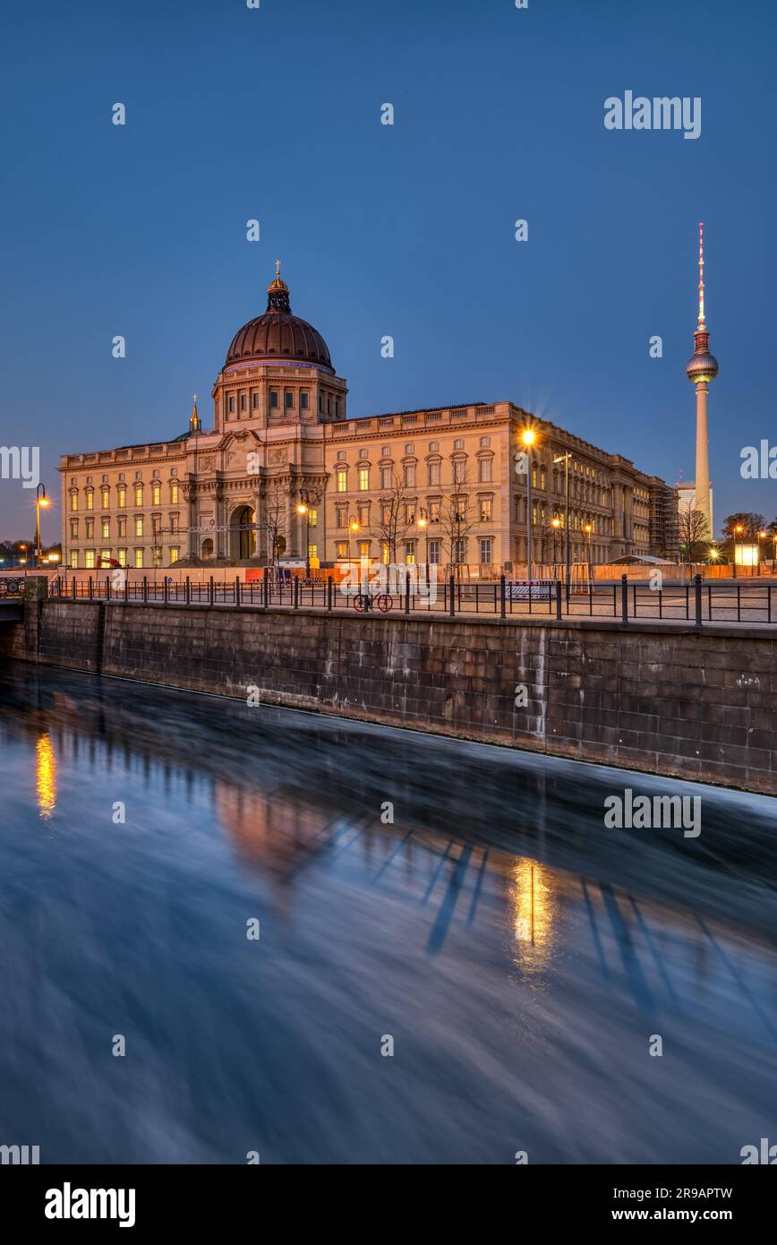 The rebuilt Berlin Palace with the TV Tower by night Stock Photo - Alamy