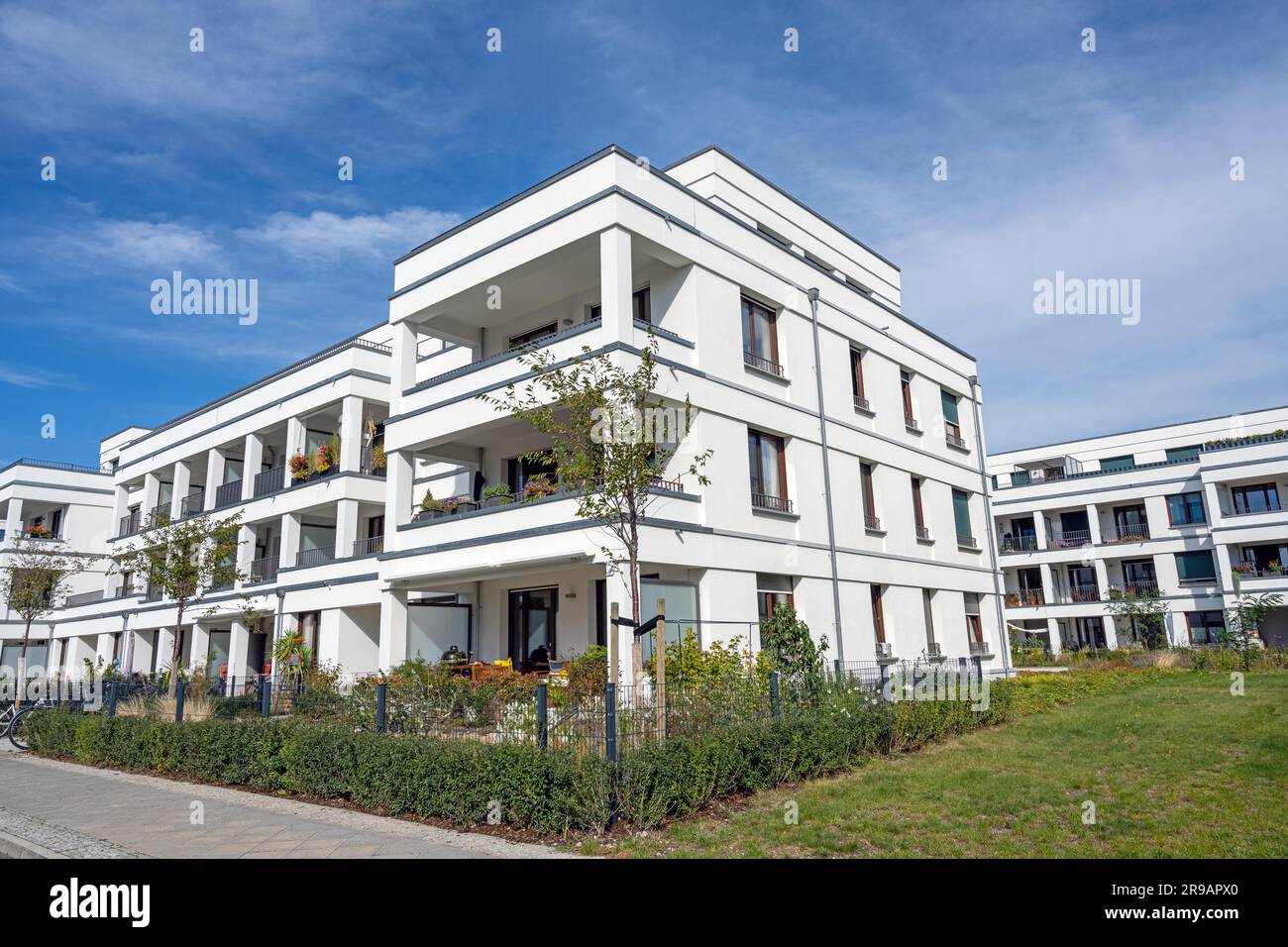 Modern white apartment buildings in a new development area in Berlin ...