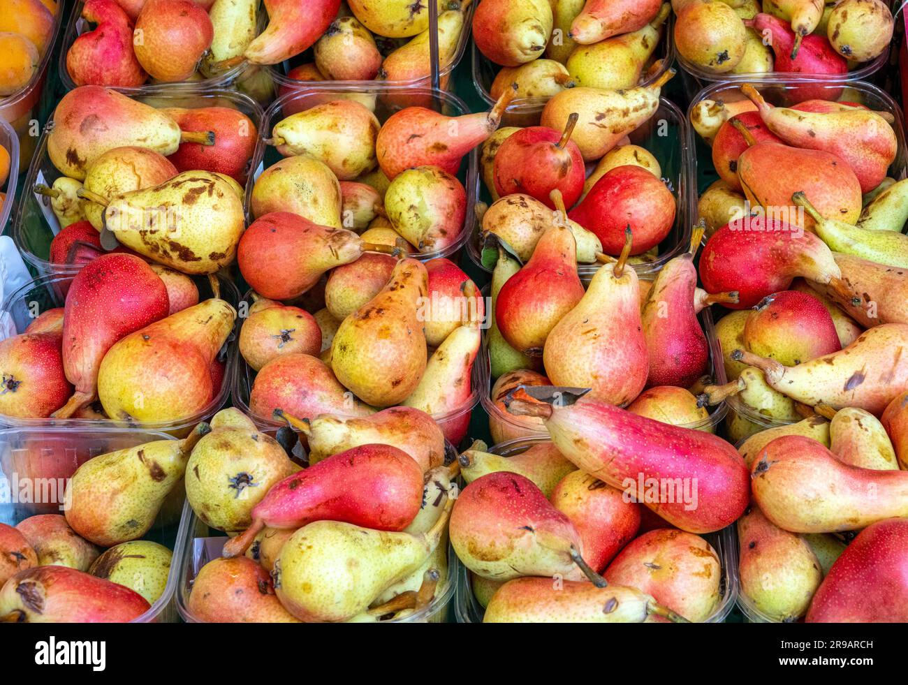 Red and yellow pears for sale at a market Stock Photo - Alamy