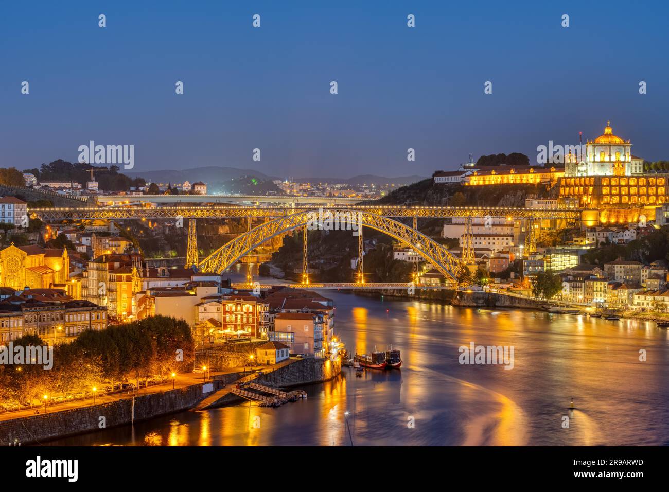 The Douro River and the famous Iron Bridge in Porto by night Stock ...