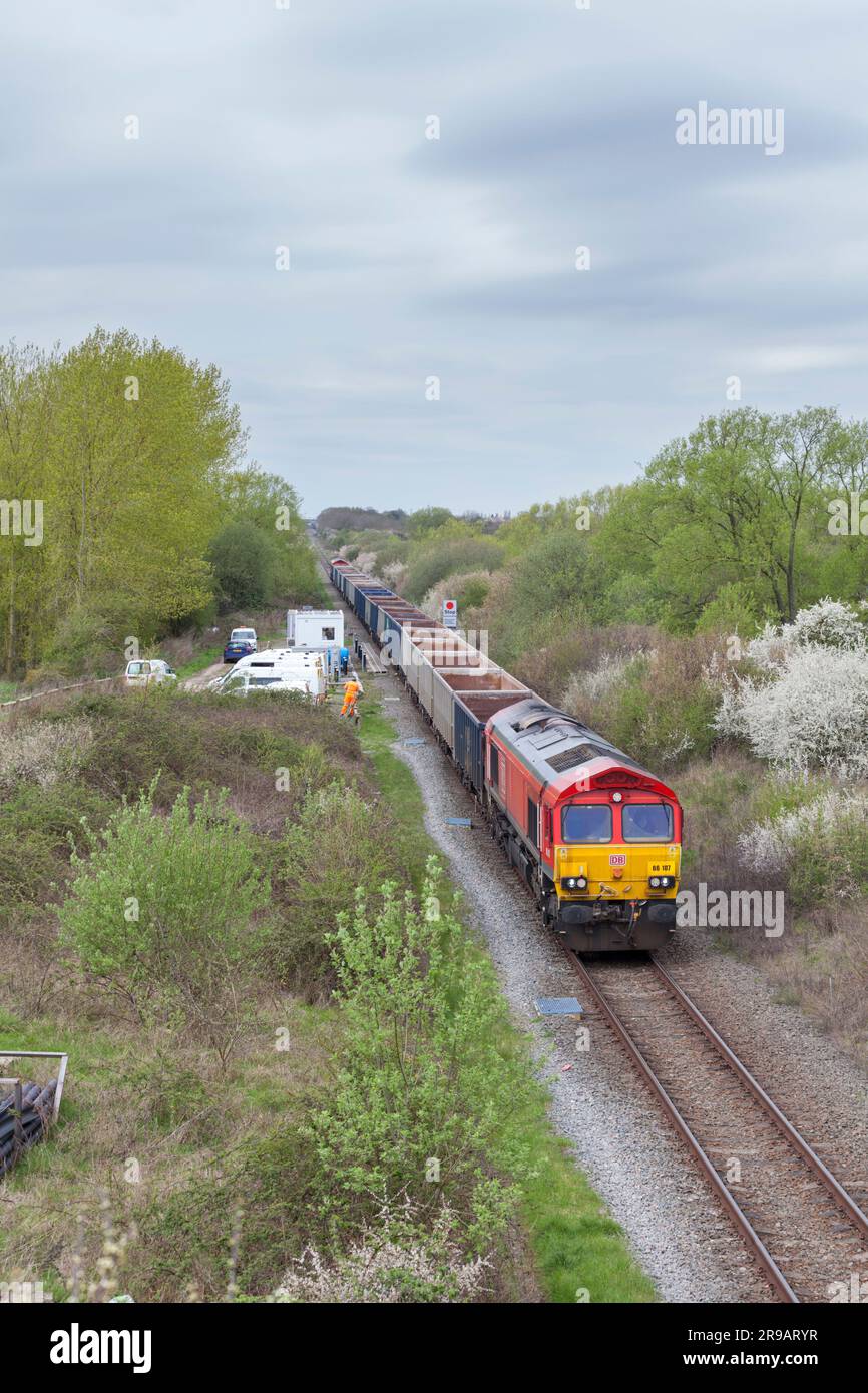 DB Cargo rail UK class 66 diesel locomotive hauling a train of empty ...