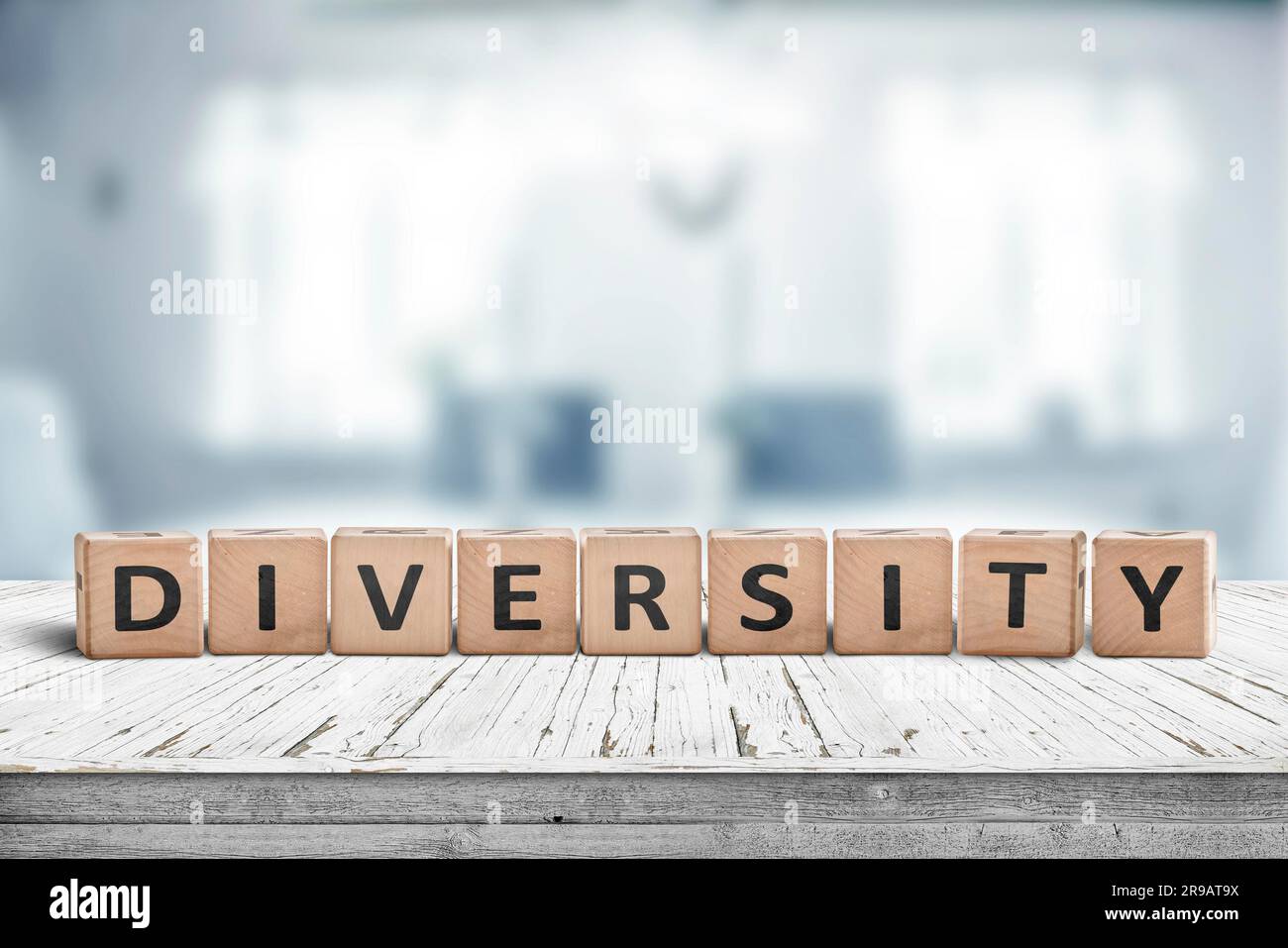 Diversity word sign on a wooden desk in a bright blue room Stock Photo ...