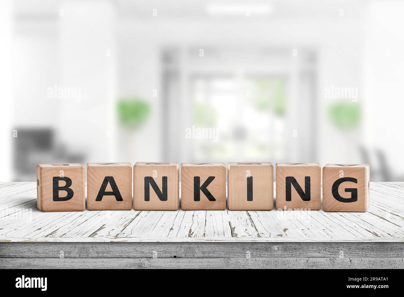 Banking sign on a wooden desk in a bright work environment Stock Photo ...