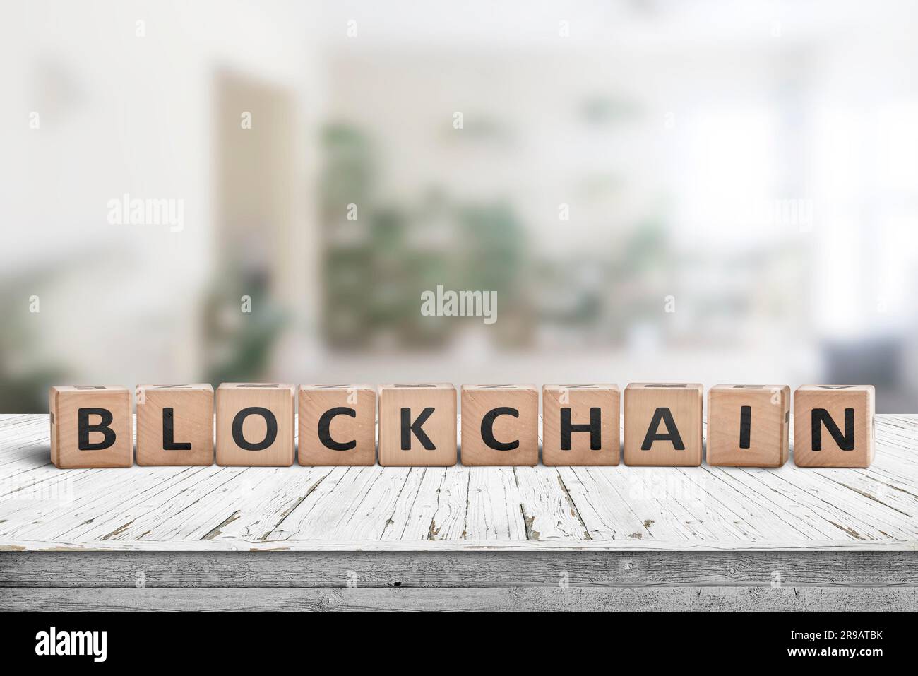 Blockchain sign made of wood on a desk in a bright living room Stock ...