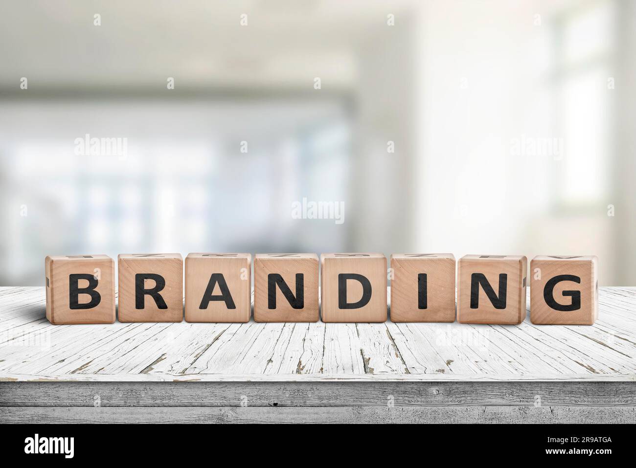 Branding sign on a desk in an office environment in bright daylight ...