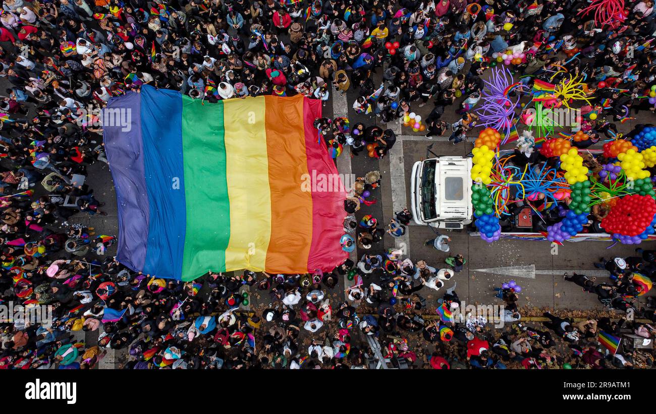 Spectators wave rainbow flag as they participate in the annual Pride ...