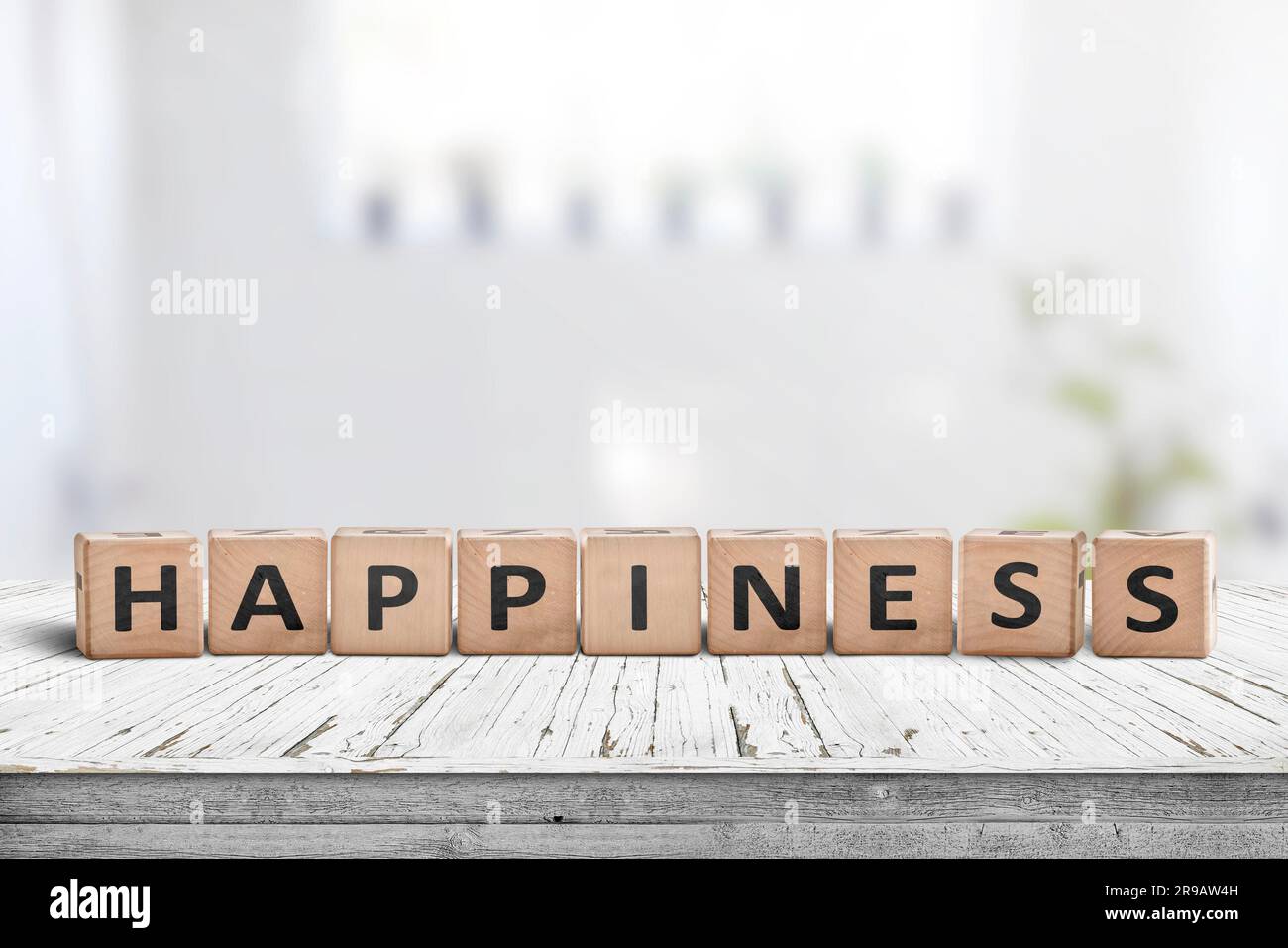 Happiness sign made of wood in a bright living room in the spring Stock ...