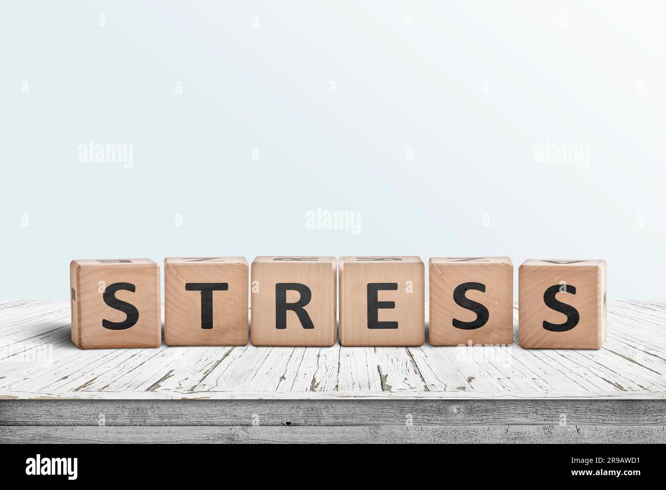 The word stress on a sign made of wooden blocks in a bright room on a ...