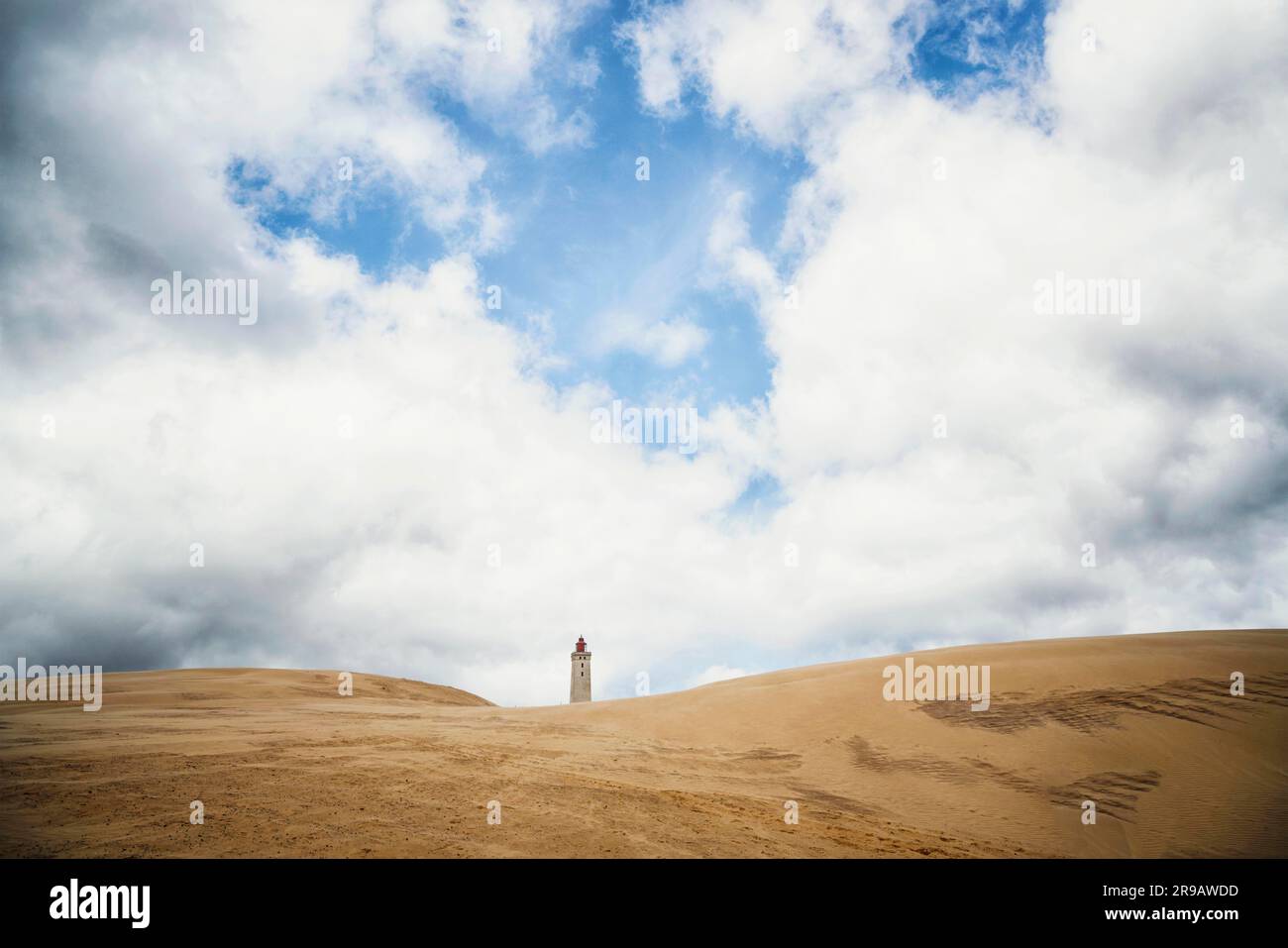 Tower rising under cloudy sky hi-res stock photography and images - Alamy