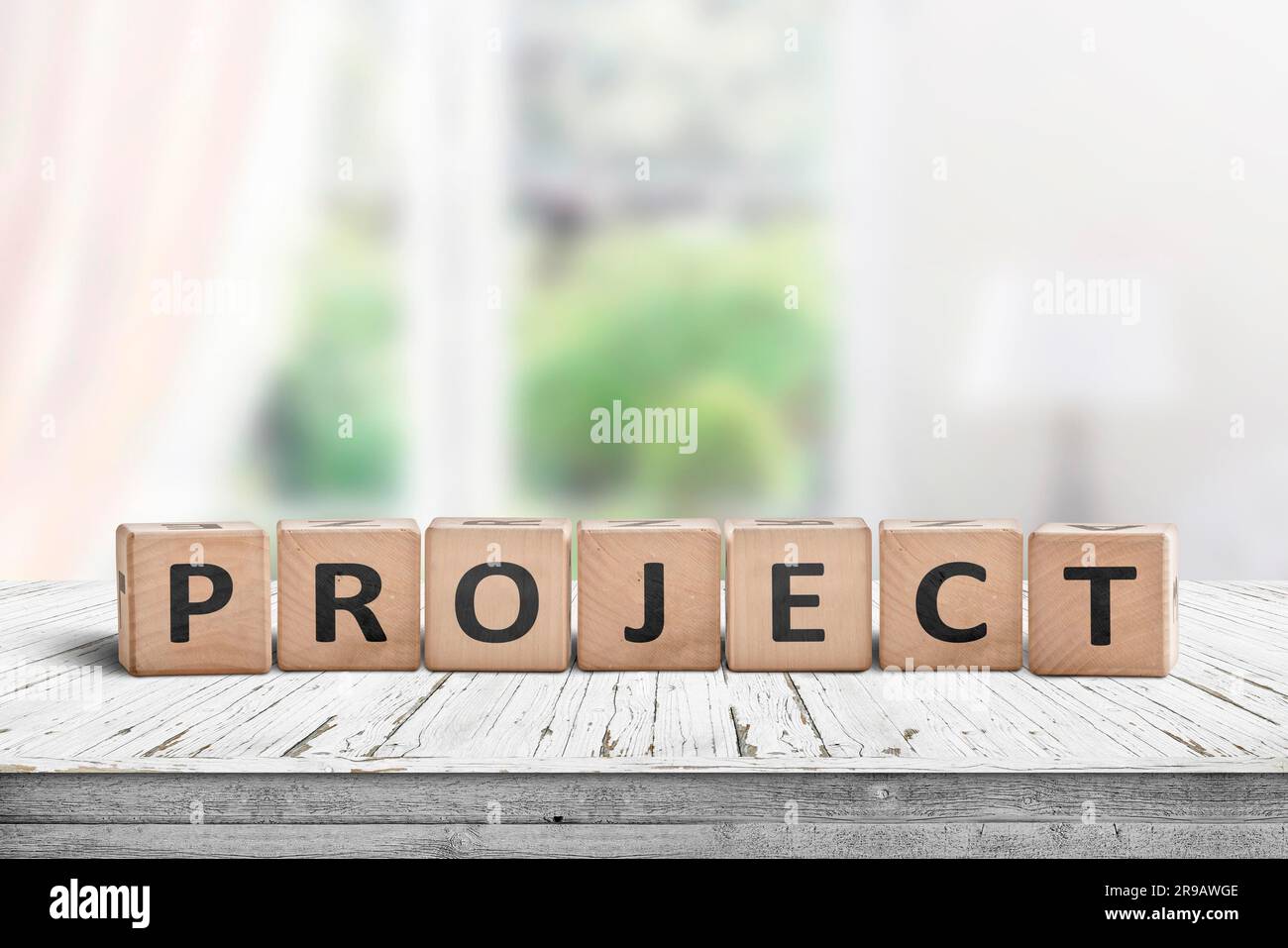 Wooden project sign in a bright room on a table with blocks Stock Photo ...