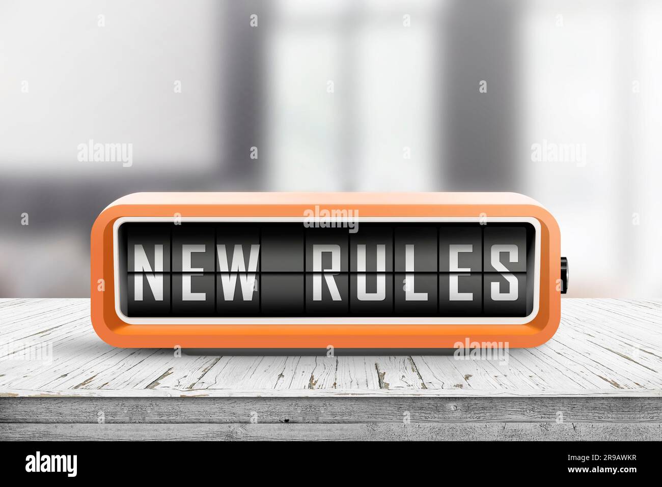 New rules alarm message on a wooden desk in a bright indoor environment ...
