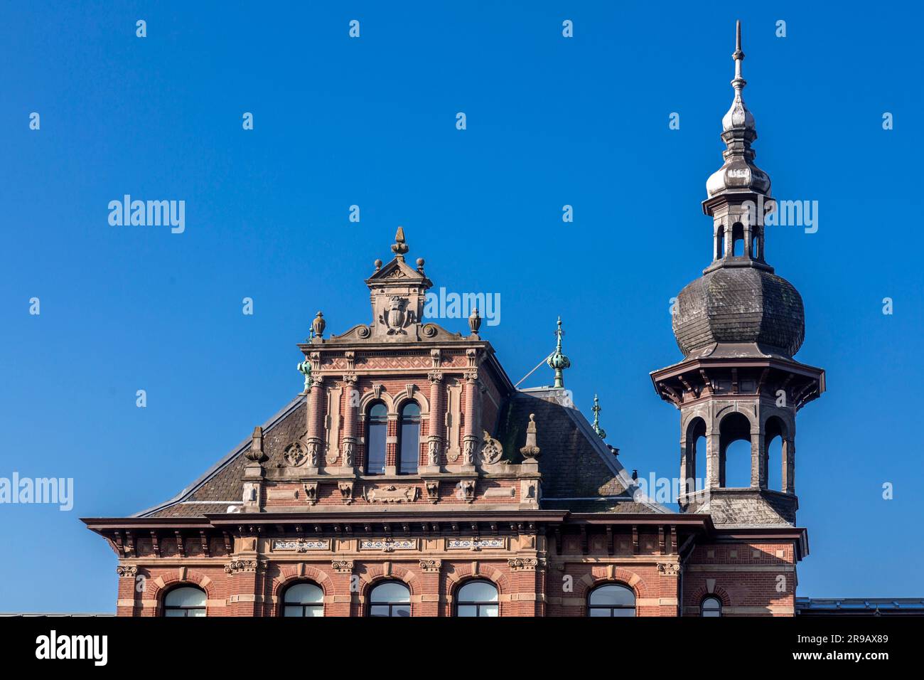 The old station of Delft next to the new station and the city hall of ...