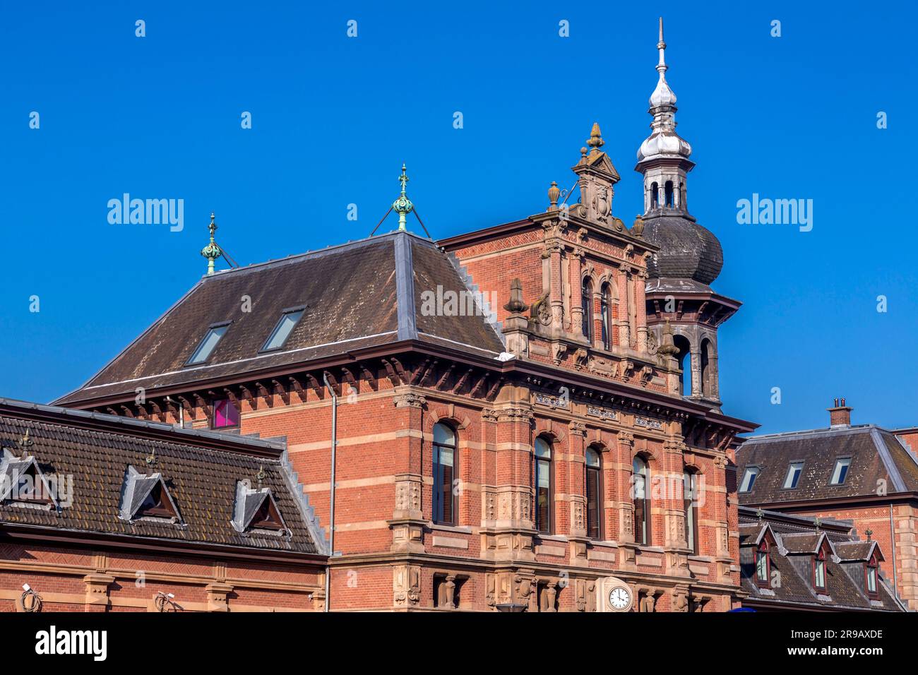 The old station of Delft next to the new station and the city hall of ...