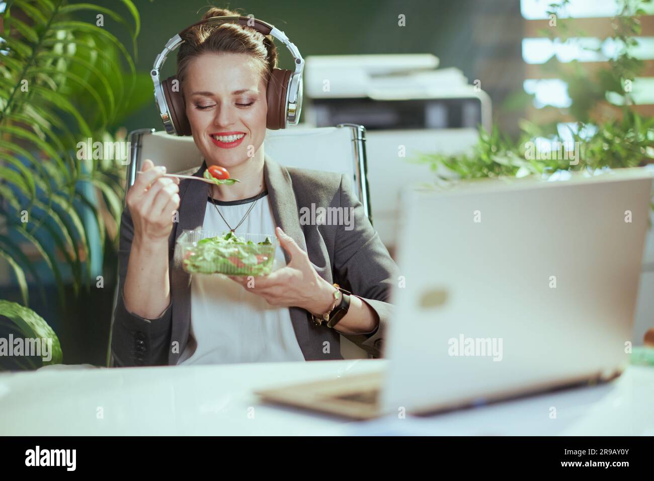 Sustainable workplace. smiling modern 40 years old bookkeeper woman in ...