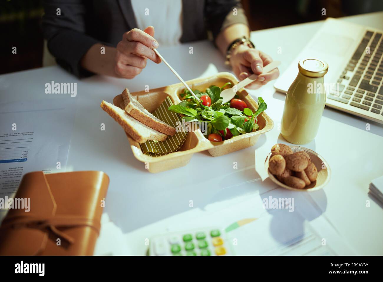 Sustainable workplace. Closeup on female employee in green office with ...