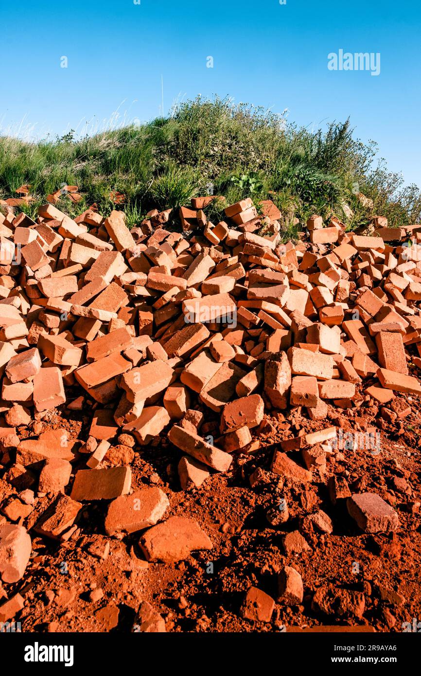 Pile of red bricks in the nature Stock Photo - Alamy