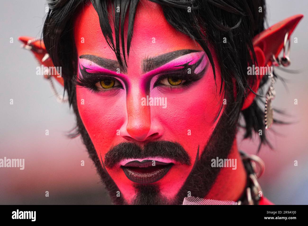 A man dressed as Octi Evil of the Power-puff Girls anime characters ...