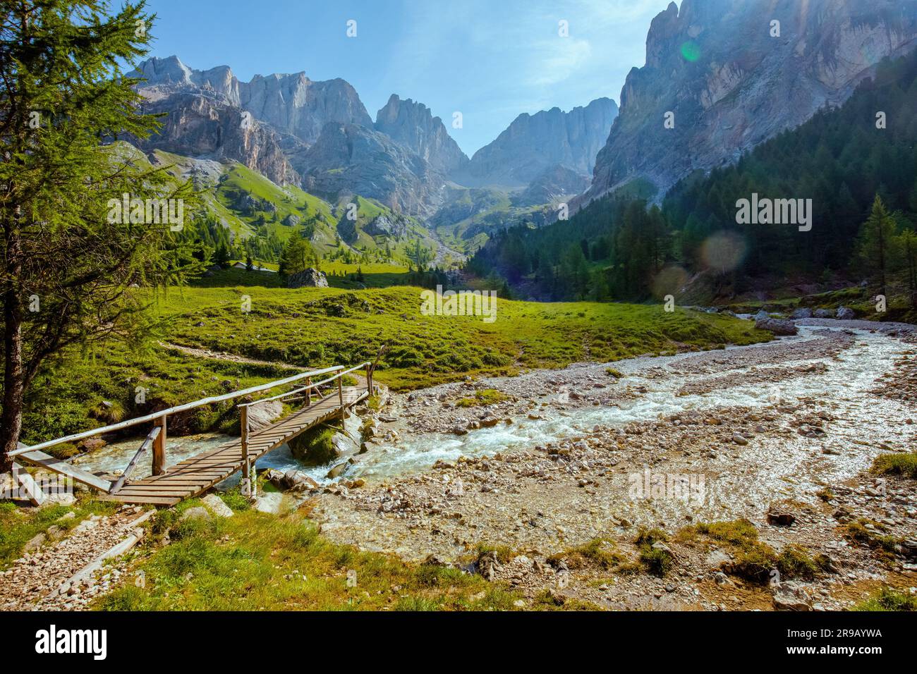 Summer time in Dolomites. landscape with mountains, river, trees and ...