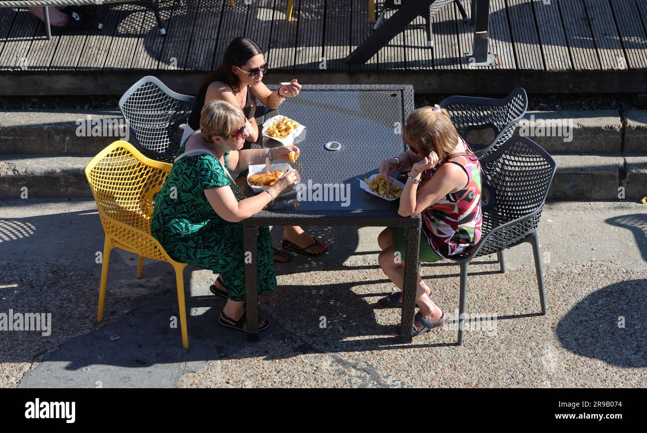Eating fish and chips at a restaurant on Brighton seafront Stock Photo ...