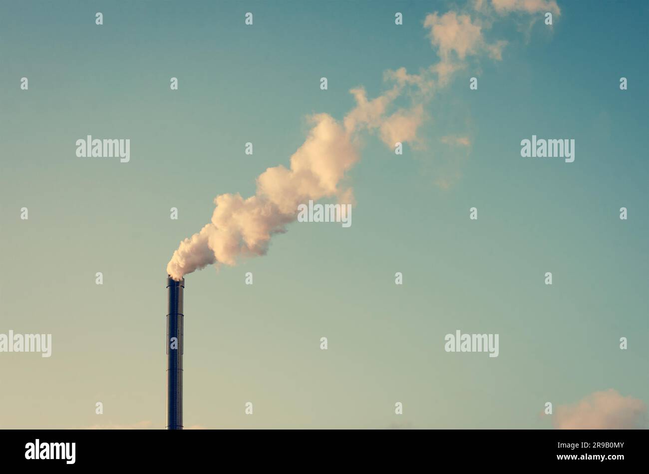 Factory chimney with white smoke Stock Photo - Alamy