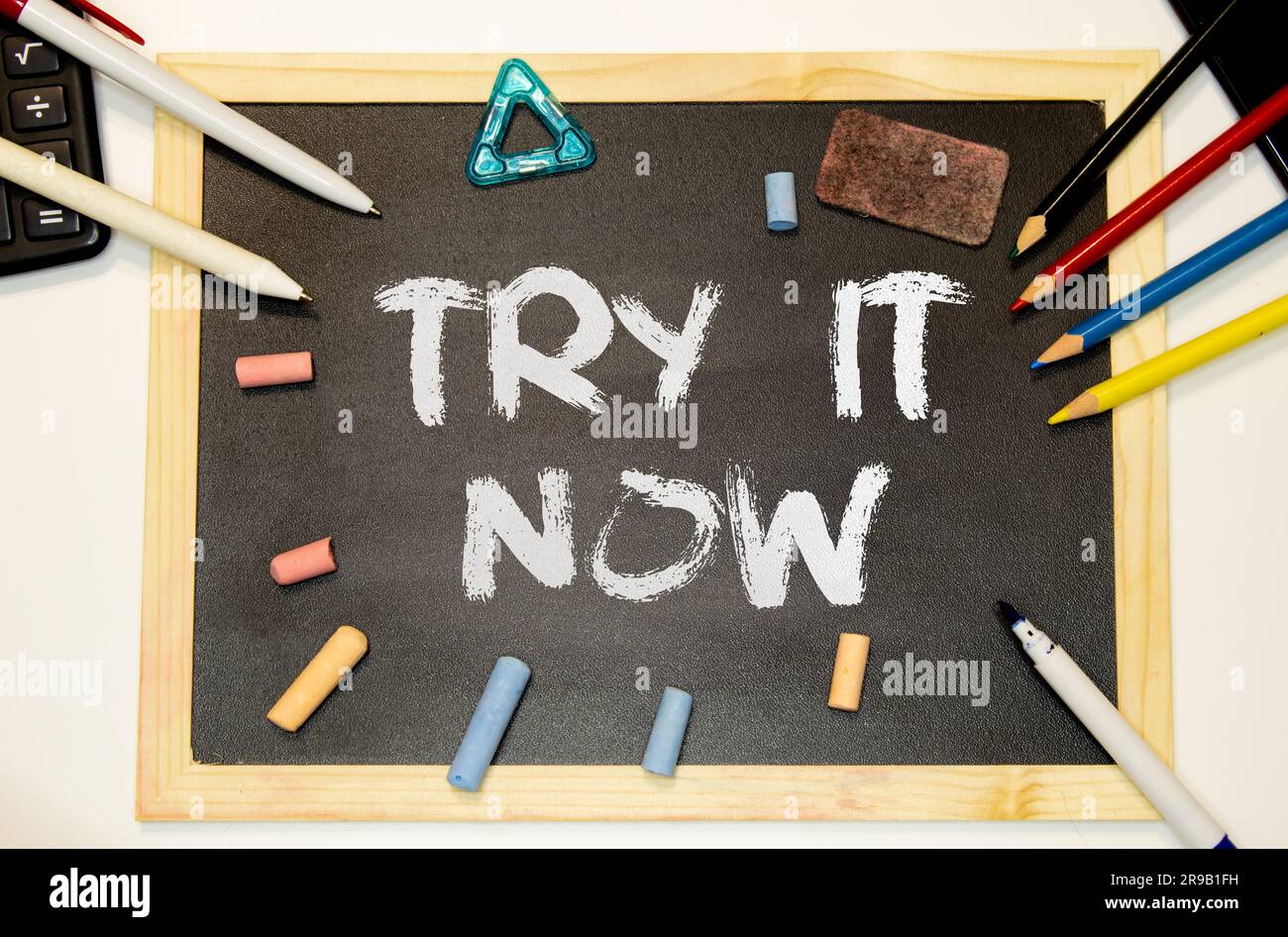 Try it now written on a sticky note pinned on a cork board Stock Photo ...