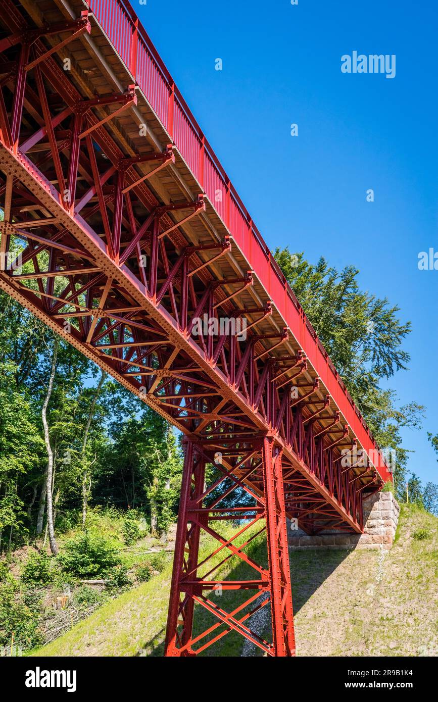 Old red metal bridge in perspective in the summertime Stock Photo - Alamy