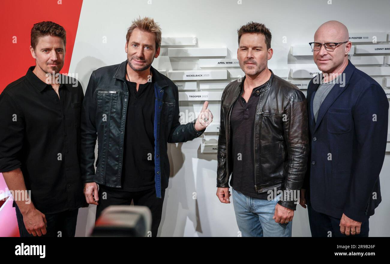 Members of the band Nickelback, consisting of, left to right, Daniel ...