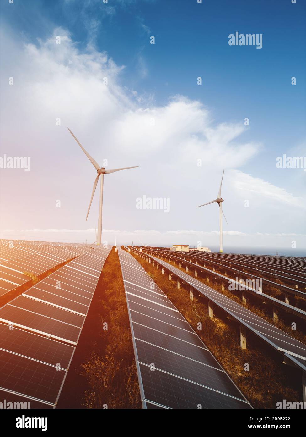 windmill and solar panel farm producing renewable energy with wind and ...