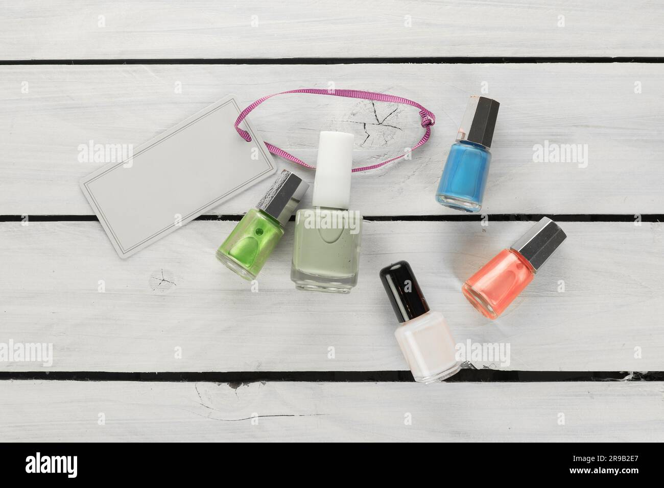 Cosmetics on a wooden background with a price tag Stock Photo - Alamy