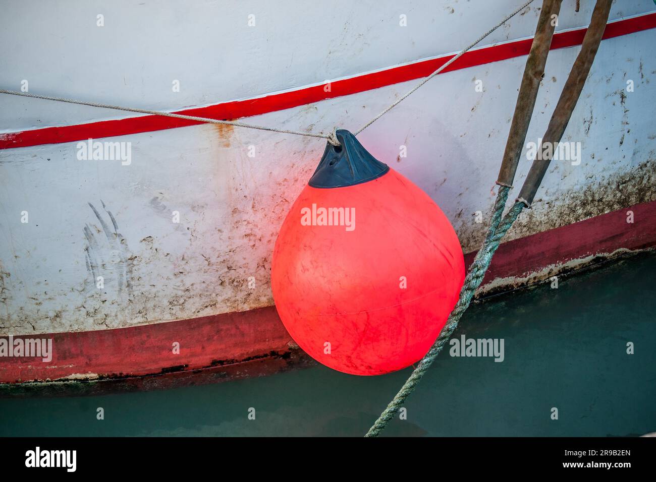 Orange buoy on an old fishing boat Stock Photo - Alamy