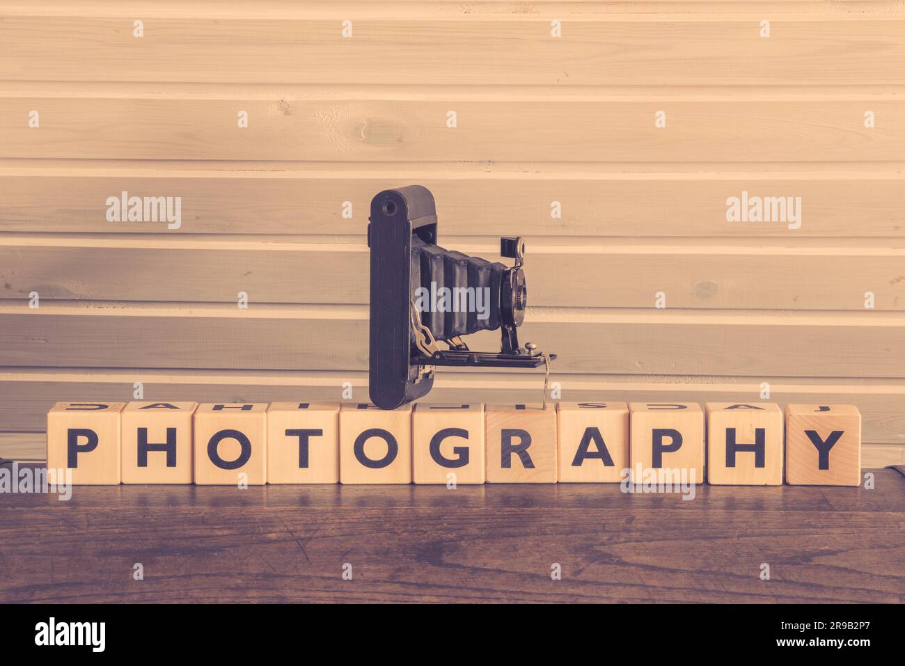 Vintage camera on a photography sign with wooden cubes Stock Photo - Alamy