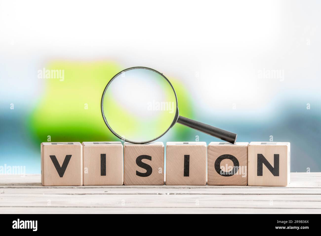 Vision word and a magnifying glass on a table Stock Photo - Alamy