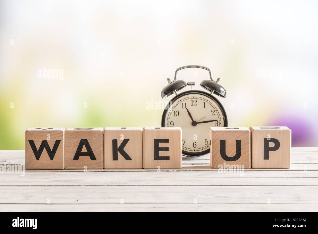 Wake up message with a classic alarm clock on a table Stock Photo - Alamy
