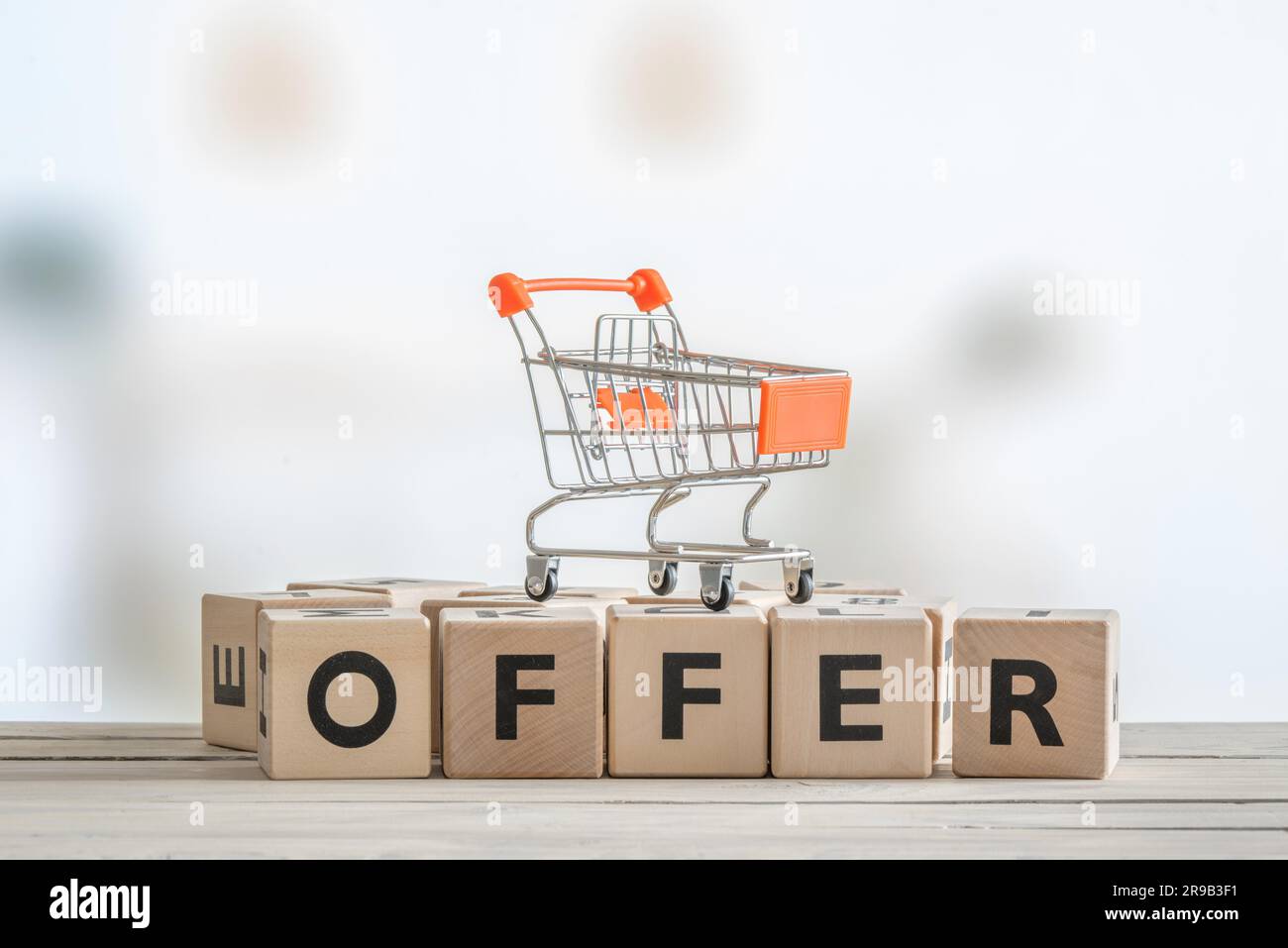 Special offer with an orange shopping cart Stock Photo - Alamy