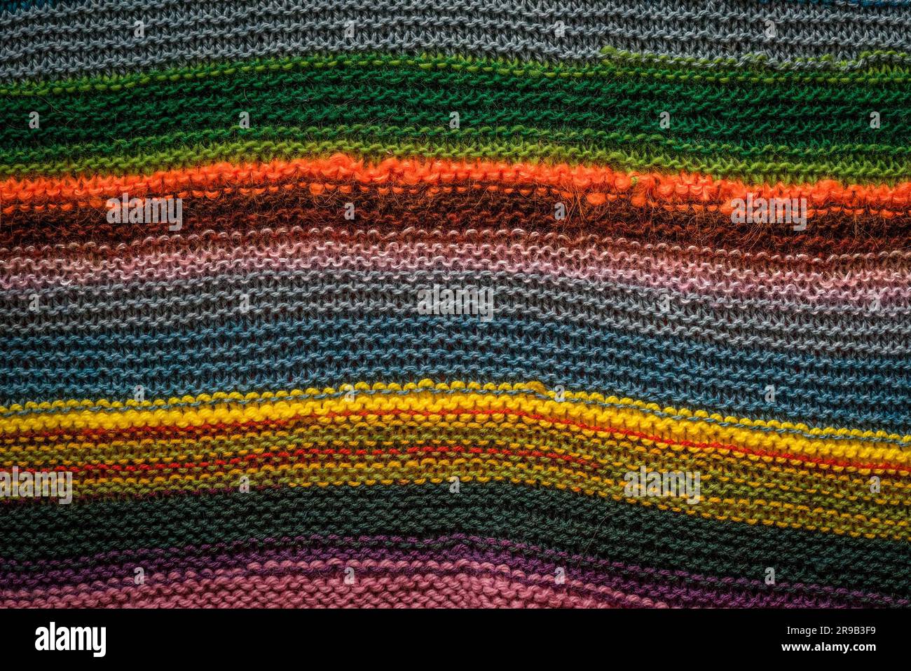 Creative knitwear background in various colors Stock Photo - Alamy