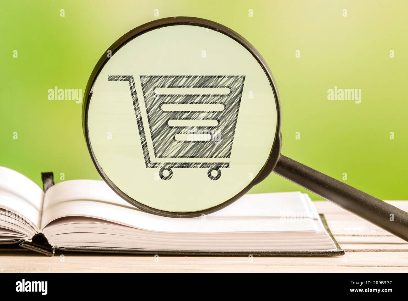 Shopping cart search with a pencil drawing of a cart in a magnifying ...